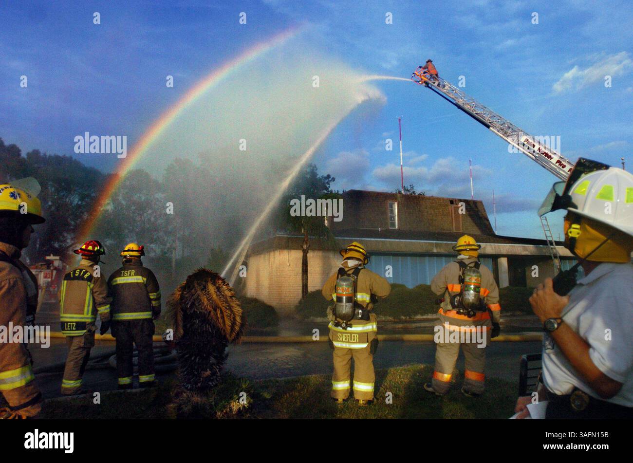 DELIVER TO NP DESK - 2) A rainbow emerges from misting water Wednesday ...