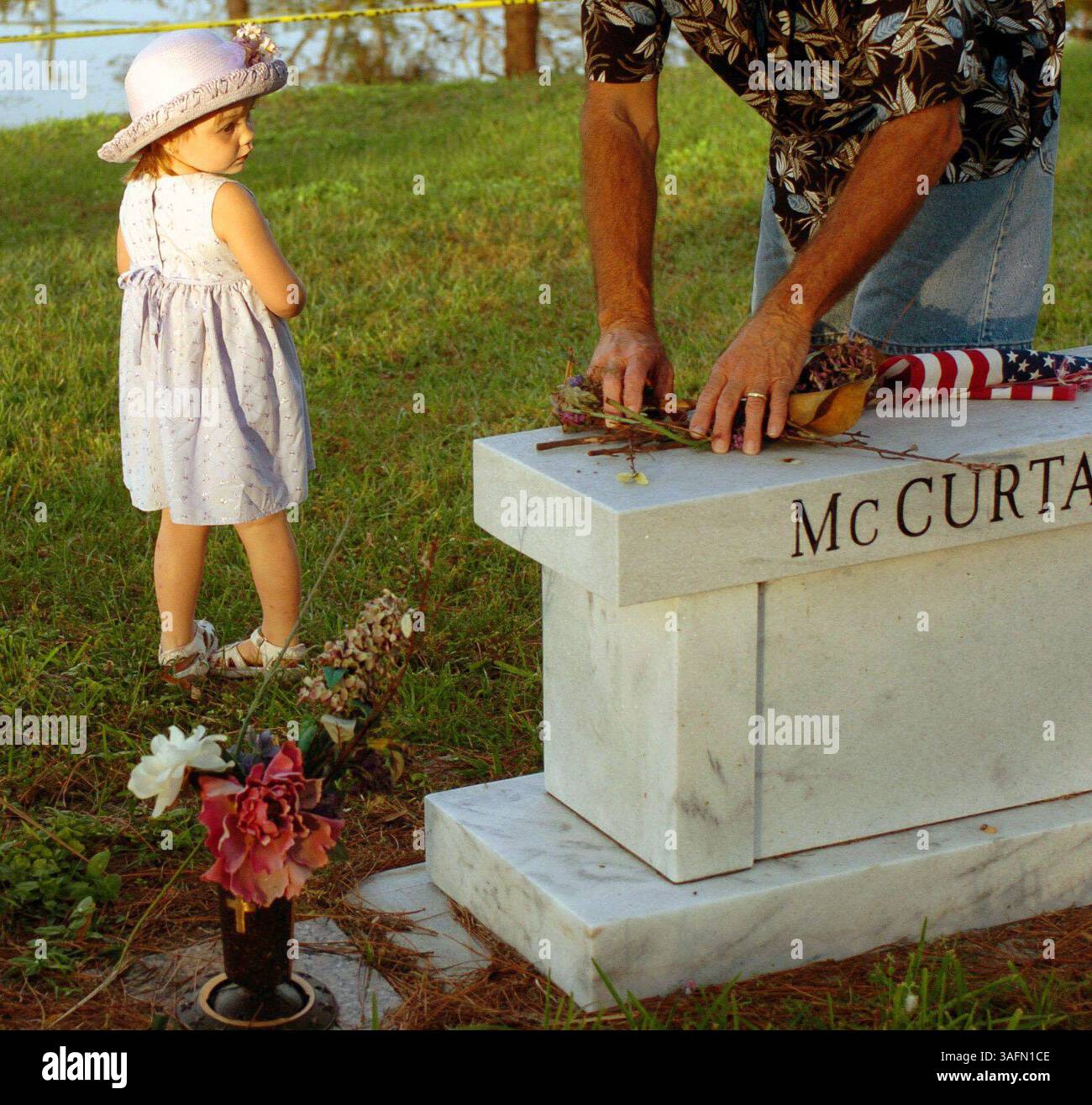 11/11/04-- Caylee Ward, 3, watches as her grandfather Joe Franco ...
