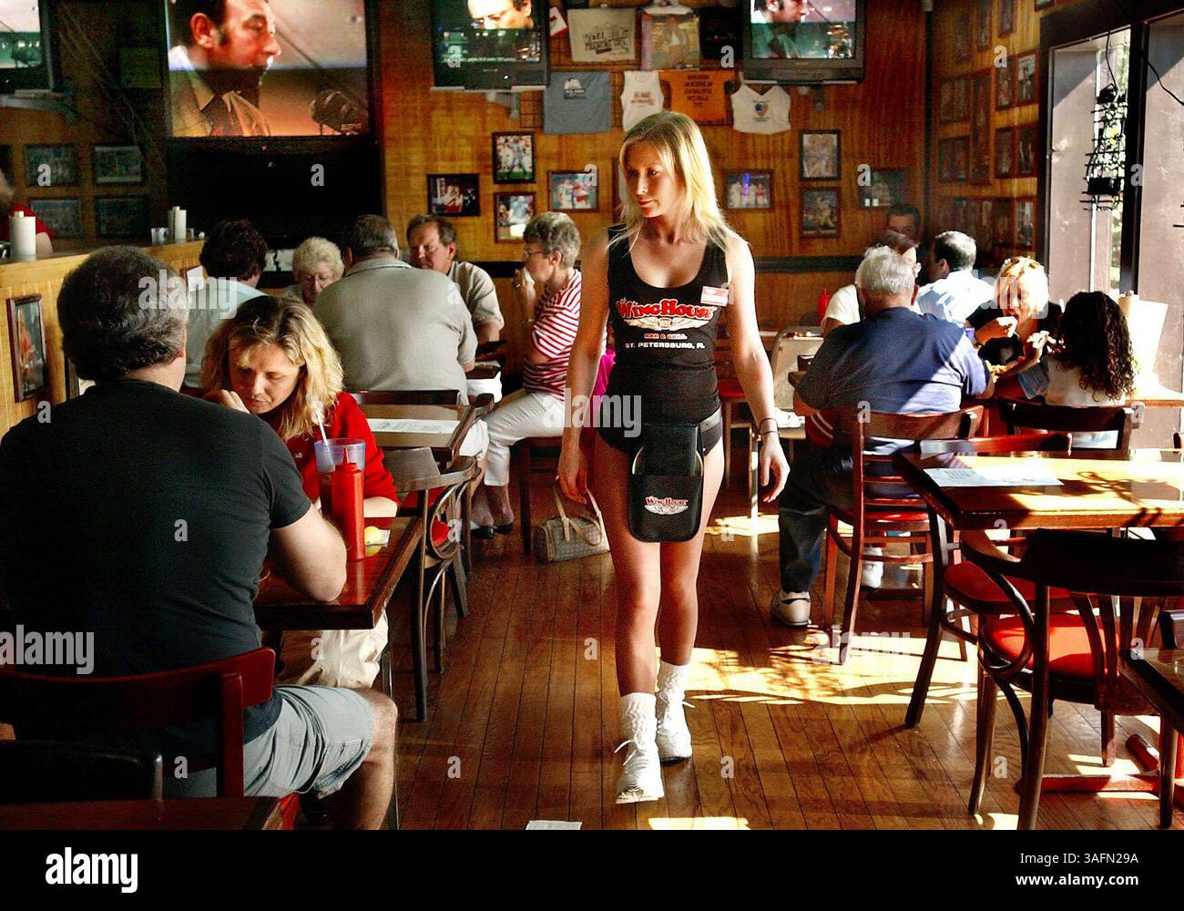 Jenny Cline, 27, waits tables at Wing House on 4th St. N. A former ...