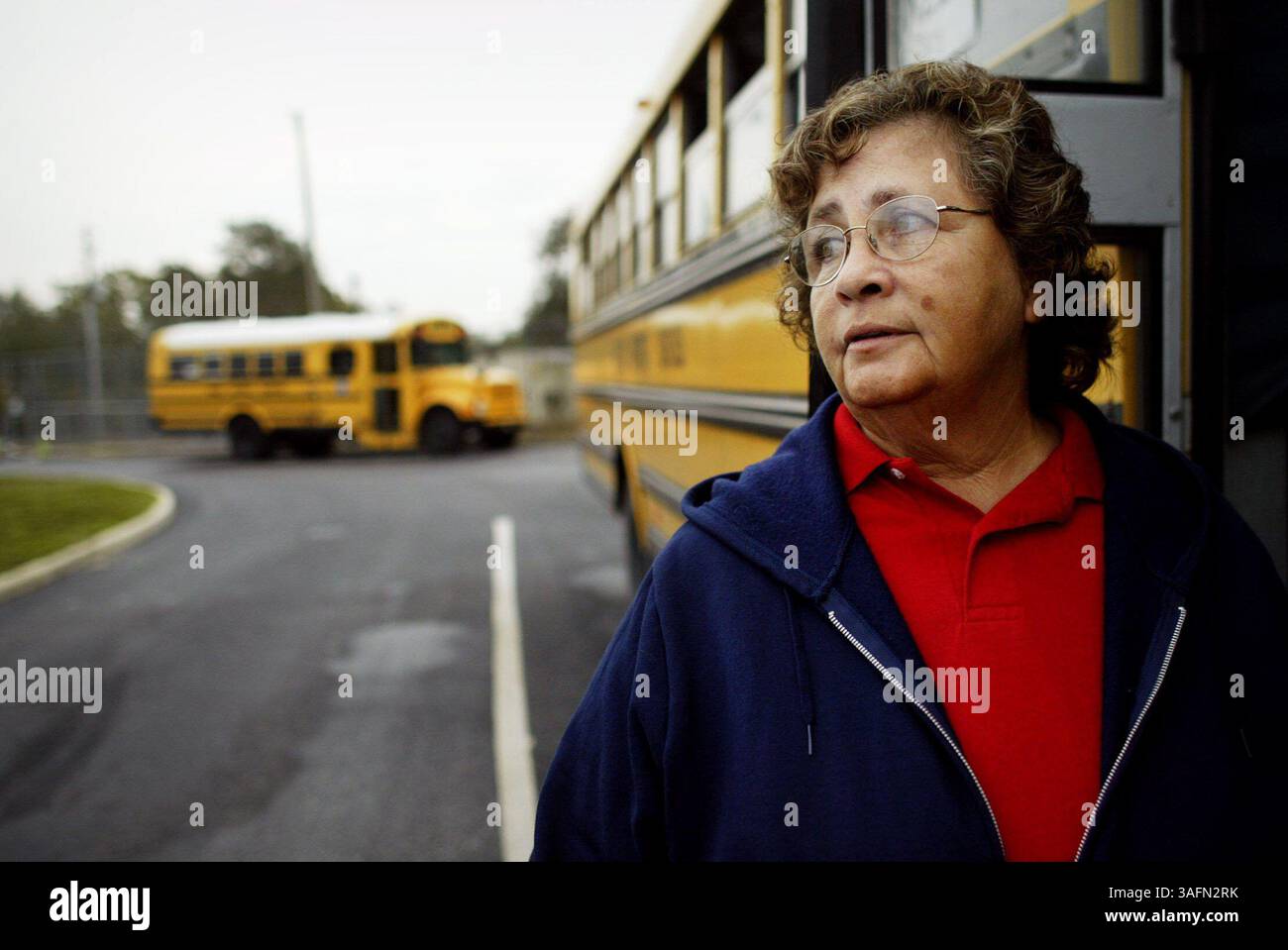 Pasco County school bus driver Ellie Frechette glances at another ...