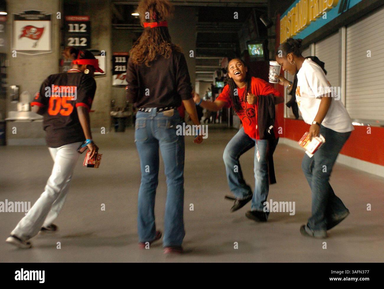 12/5/2004-- Tasha Mitchell, 18, left, Whitley Johnson, 17, Tanica Mann ...