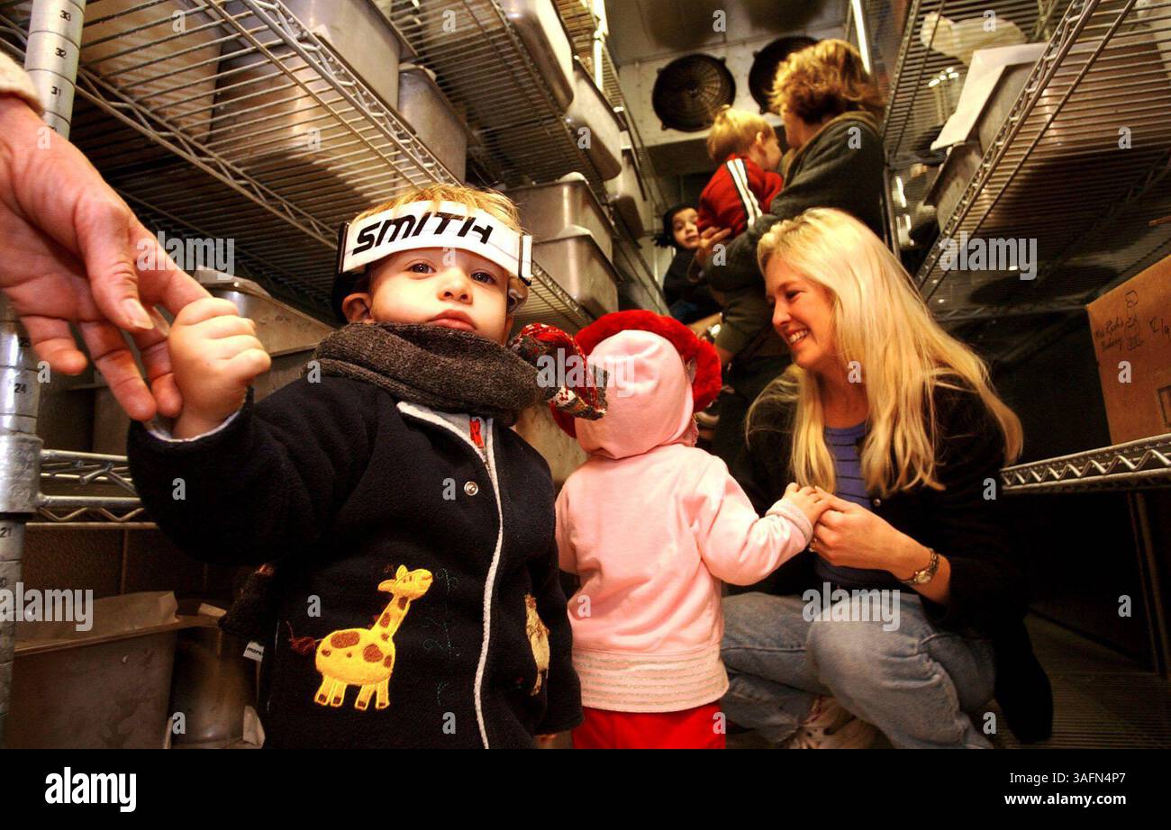 1- (From left) Jeffrey Slaven (cq), 2, clings to his grandmother's hand ...