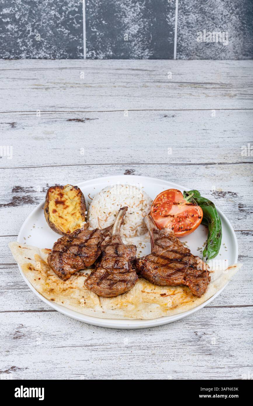 Grilled lamb chops in delicious view, Turkish name kuzu pirzola ...