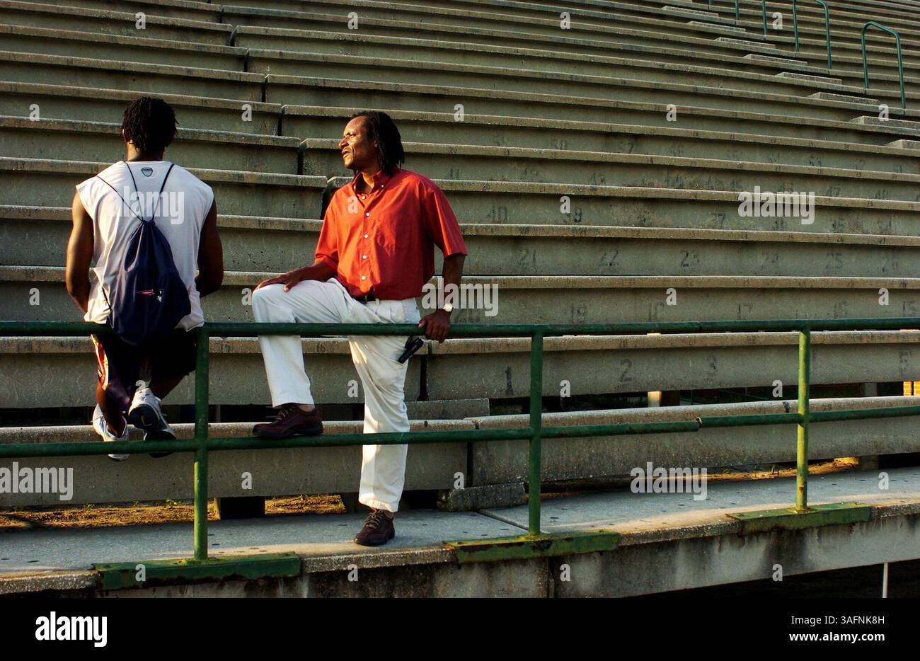 Tampa, 06/16/2005) PHOTO 1: Calvin Smith talks to his son Calvin after ...