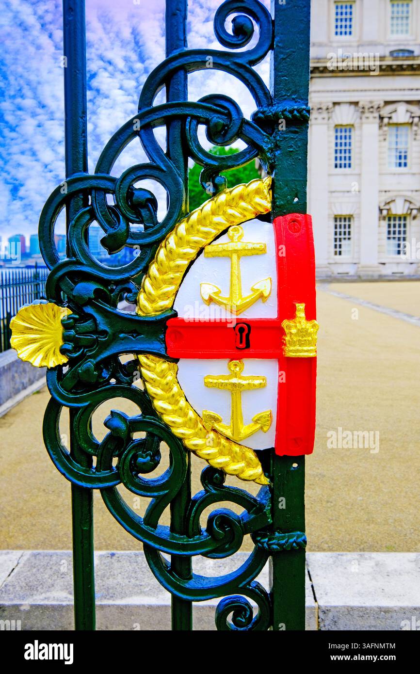 Gate crest at Greenwich Naval Museum London against deep blue sky and ...
