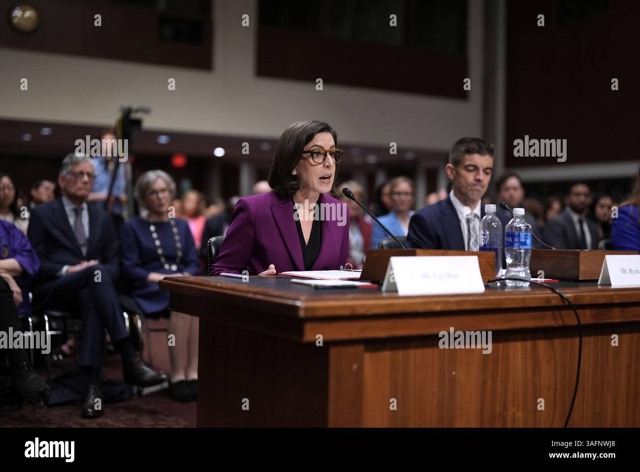 Former Justice Department attorneys Liz Oyer and Ryan Crosswell ...