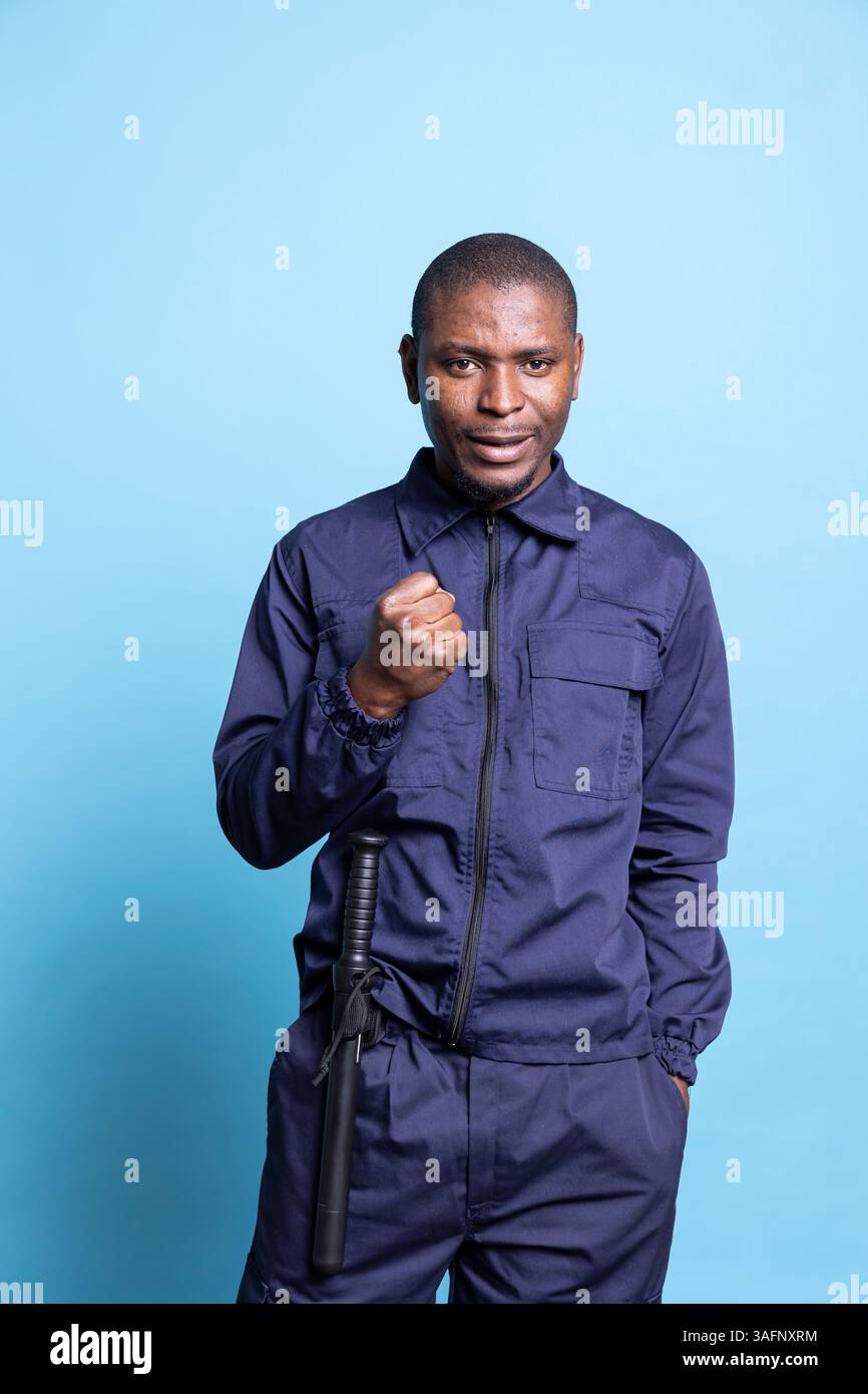 Happy security guard cheering about something in studio, feeling very ...