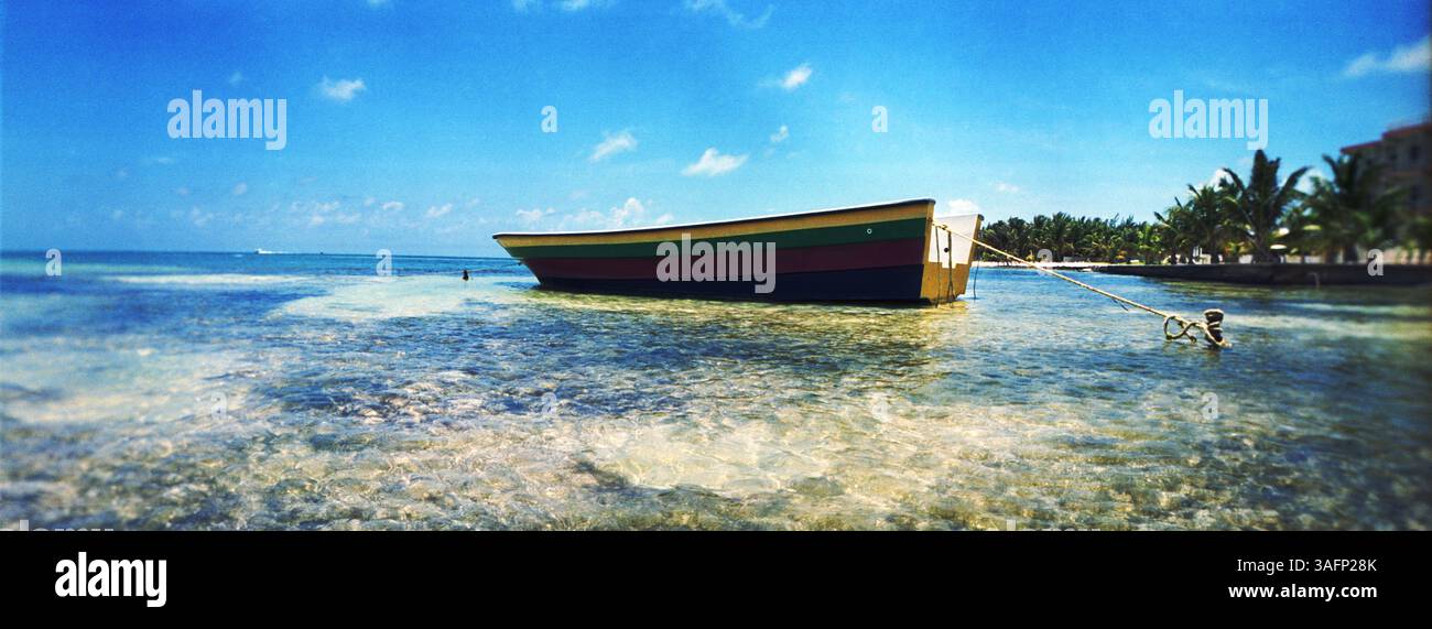 Boat moored on the beach, San Pedro, Ambergris Caye, Belize Stock Photo ...