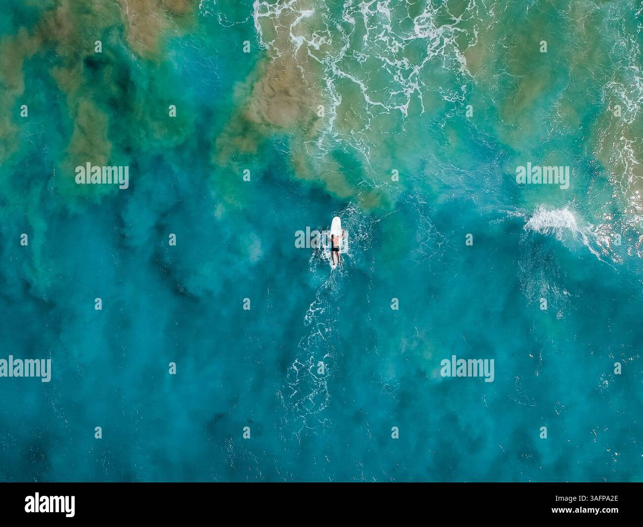 Aerial view of the mesmerizing turquoise waters and rugged cliffs of El ...