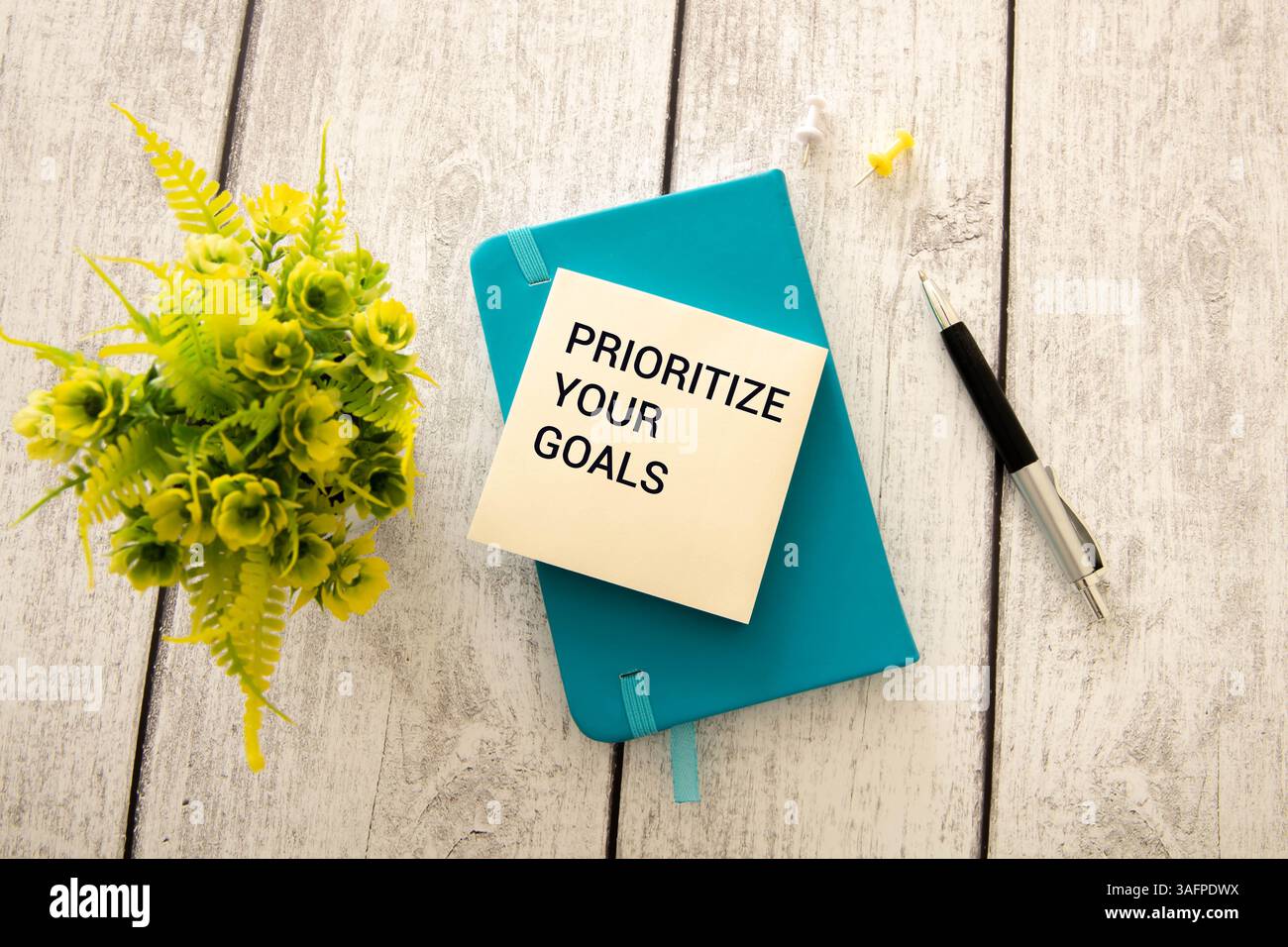 Priority symbol. Wooden blocks with words 'Prioritize your work ...