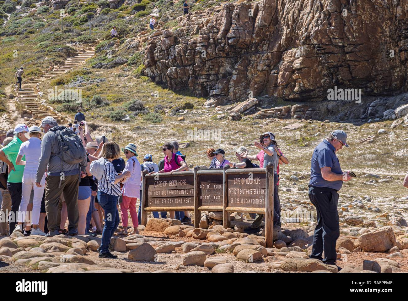 Tourists crowd round to take pictures with the iconic name sign at the ...