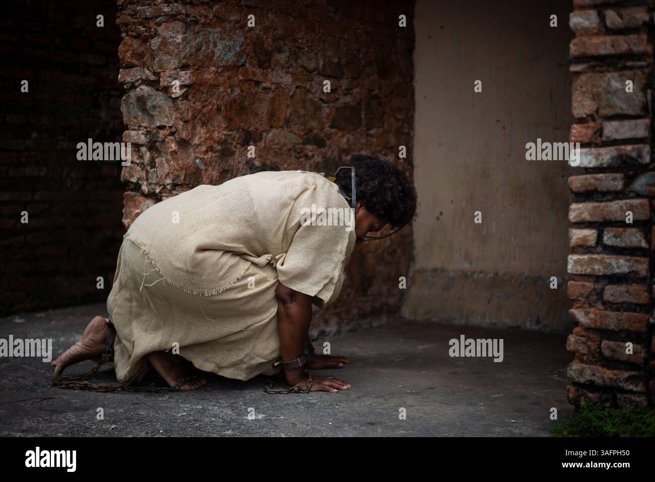 Portrait of a black woman in chains, with an iron mask over her mouth ...