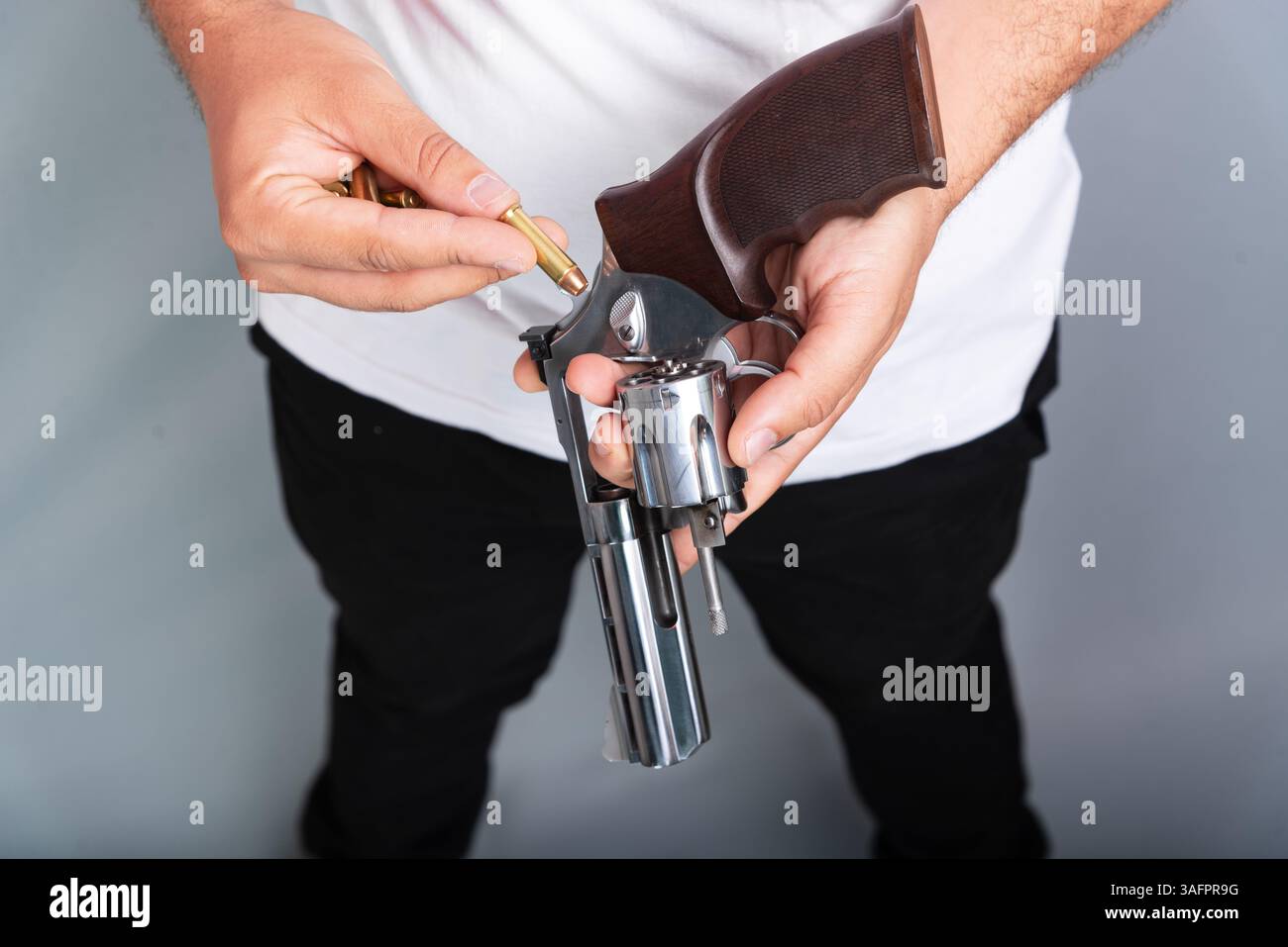 Top down view of a shooting instructor wearing black pants and white ...