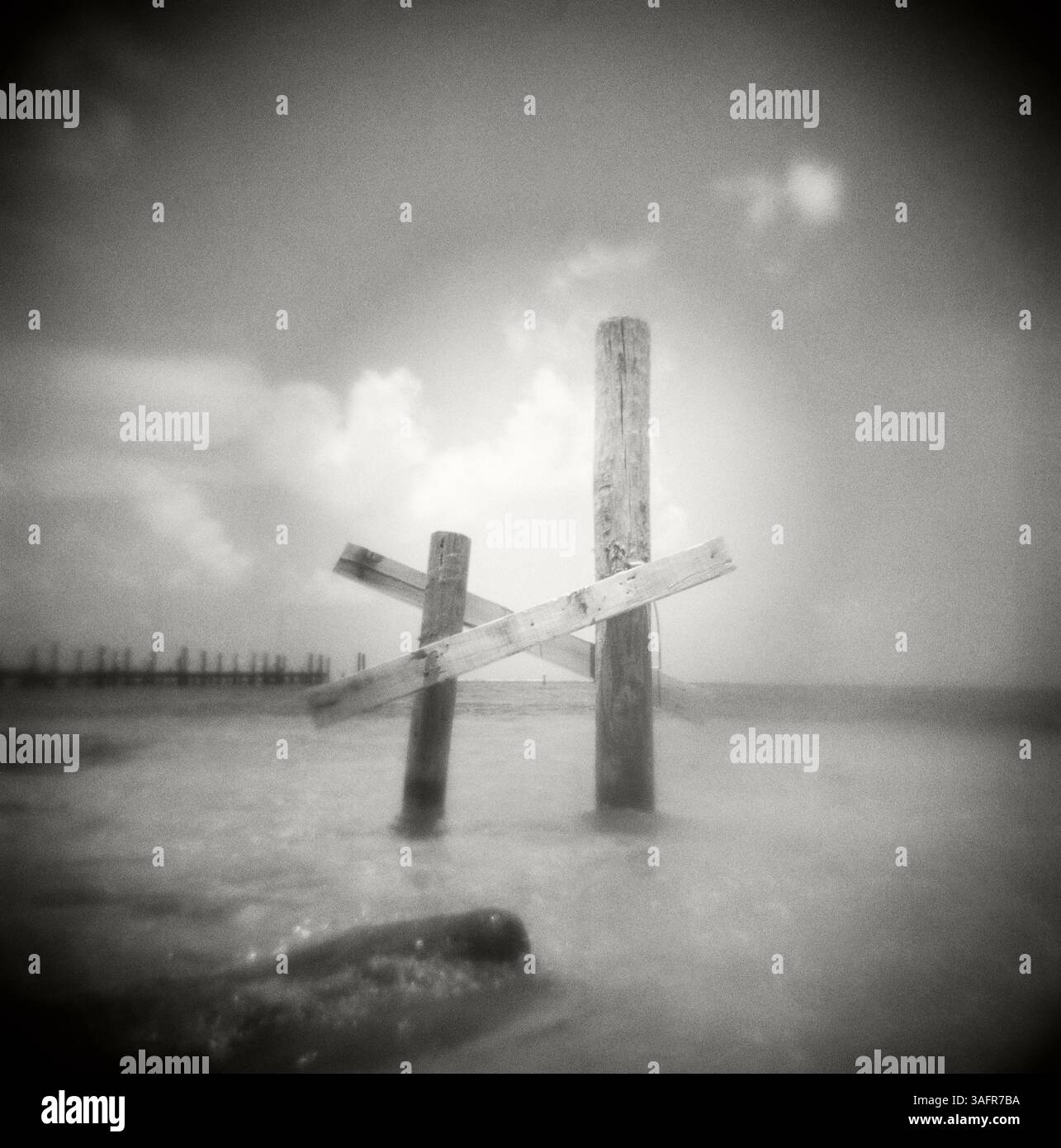 Old dock posts on the beach, San Pedro, Ambergris Caye, Belize, Central ...