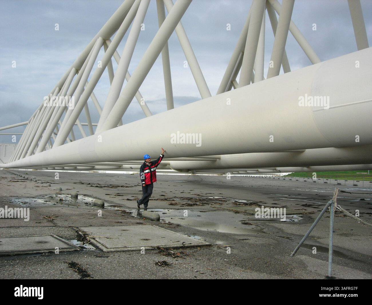 the storm barrier near Rotterdan dwarfs engineer Peter Peerson - each ...