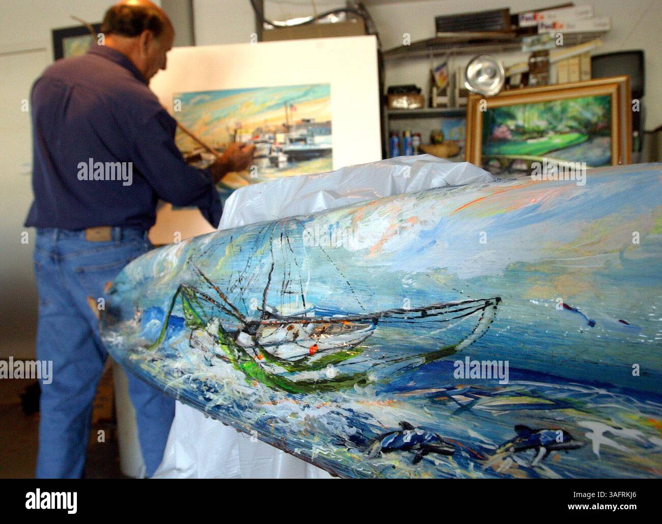 CAPTION: (Hudson: 01/04/2006) Hudson artist Leonard Lewis (cq) paints ...