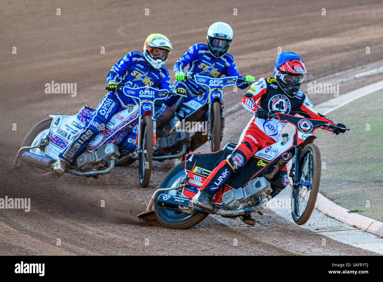 Zach Cook of Belle Vue Aces in Blue picks up some drive ahead of Niels ...