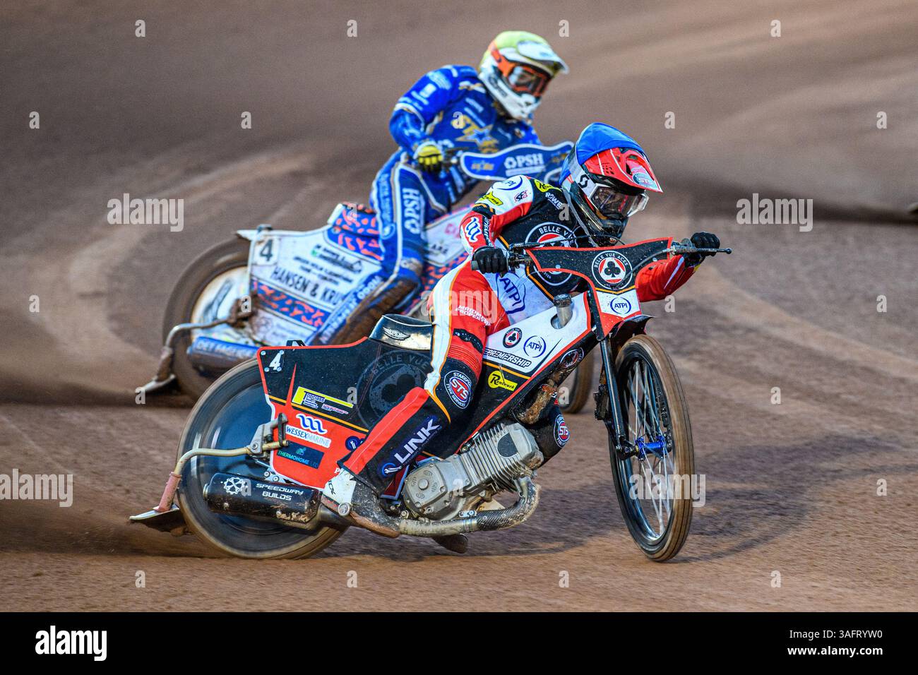 Zach Cook of Belle Vue Aces in Blue leading Niels-Kristian Iversen of ...
