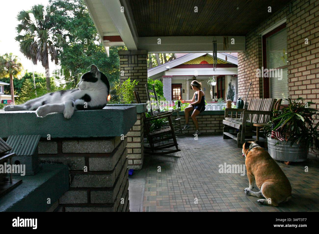 CAPTION: (St. Petersburg, 06/22/2006) Lisa Zupko (cq) lights a tiki ...