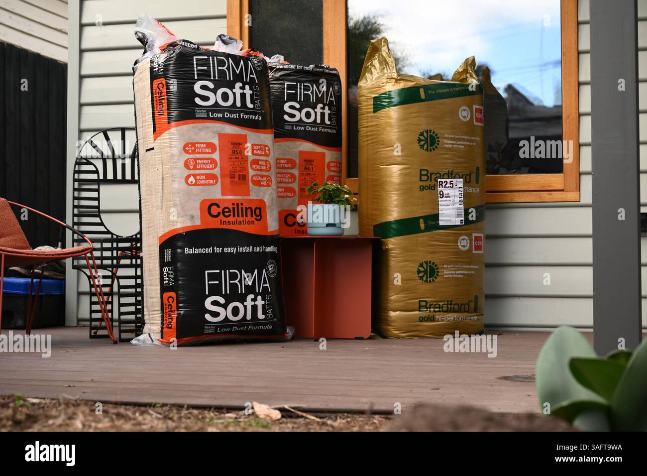 Firmasoft insulation batts on display during an announcement on ceiling ...