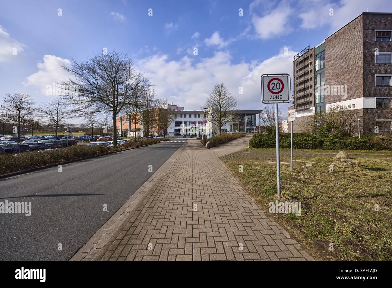 Zone 20 sign, town hall, trees, concrete pavement, asphalt road, blue ...