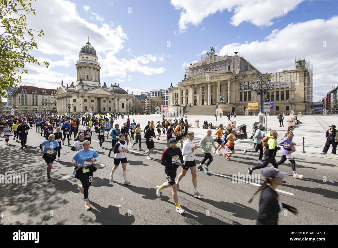 Runners in front of the German Cathedral and the concert hall am ...
