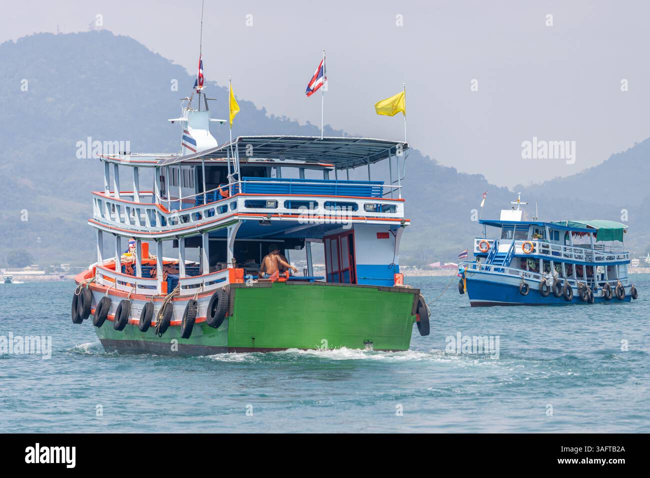 Traditional wooden ferries sail between the mainland and islands in ...