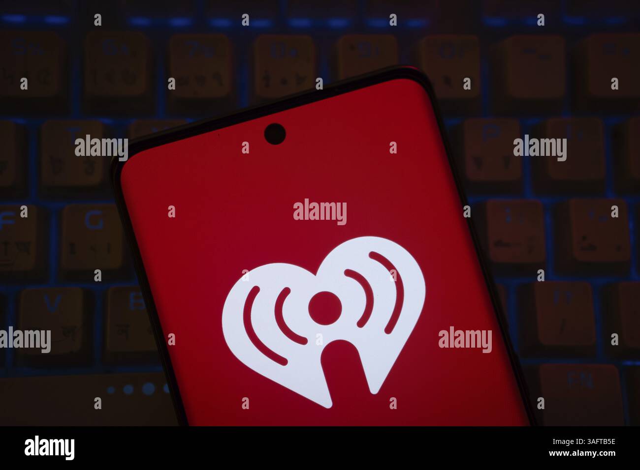 The logo of the iHeartRadio is displayed on a smartphone screen Stock ...