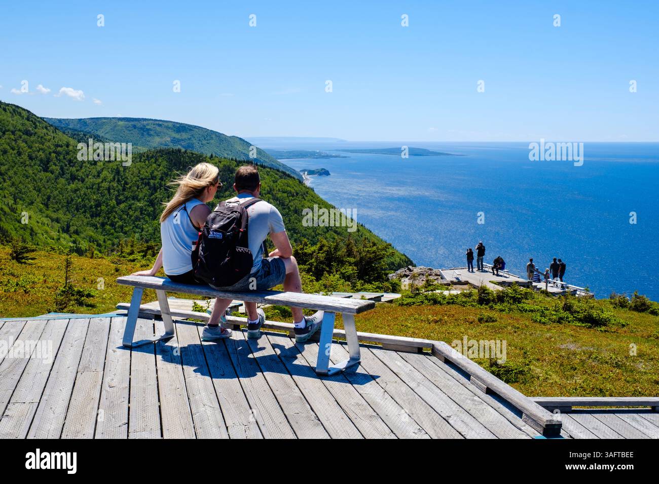 People at Skyline Headland Trail boardwalk, Cabot Trail Summer landscape, Cape Breton Island ...