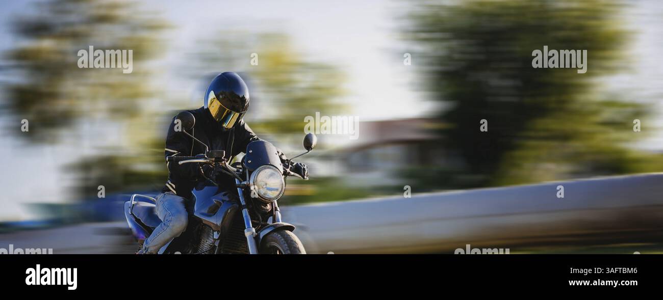 Motorcyclist in motion with blurred background, showcasing speed and ...
