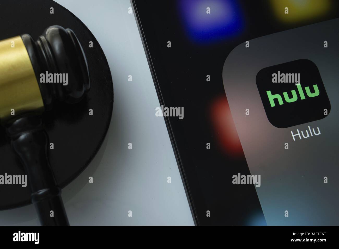 A close up of an iPad screen displaying the hulu app alongside a judge ...
