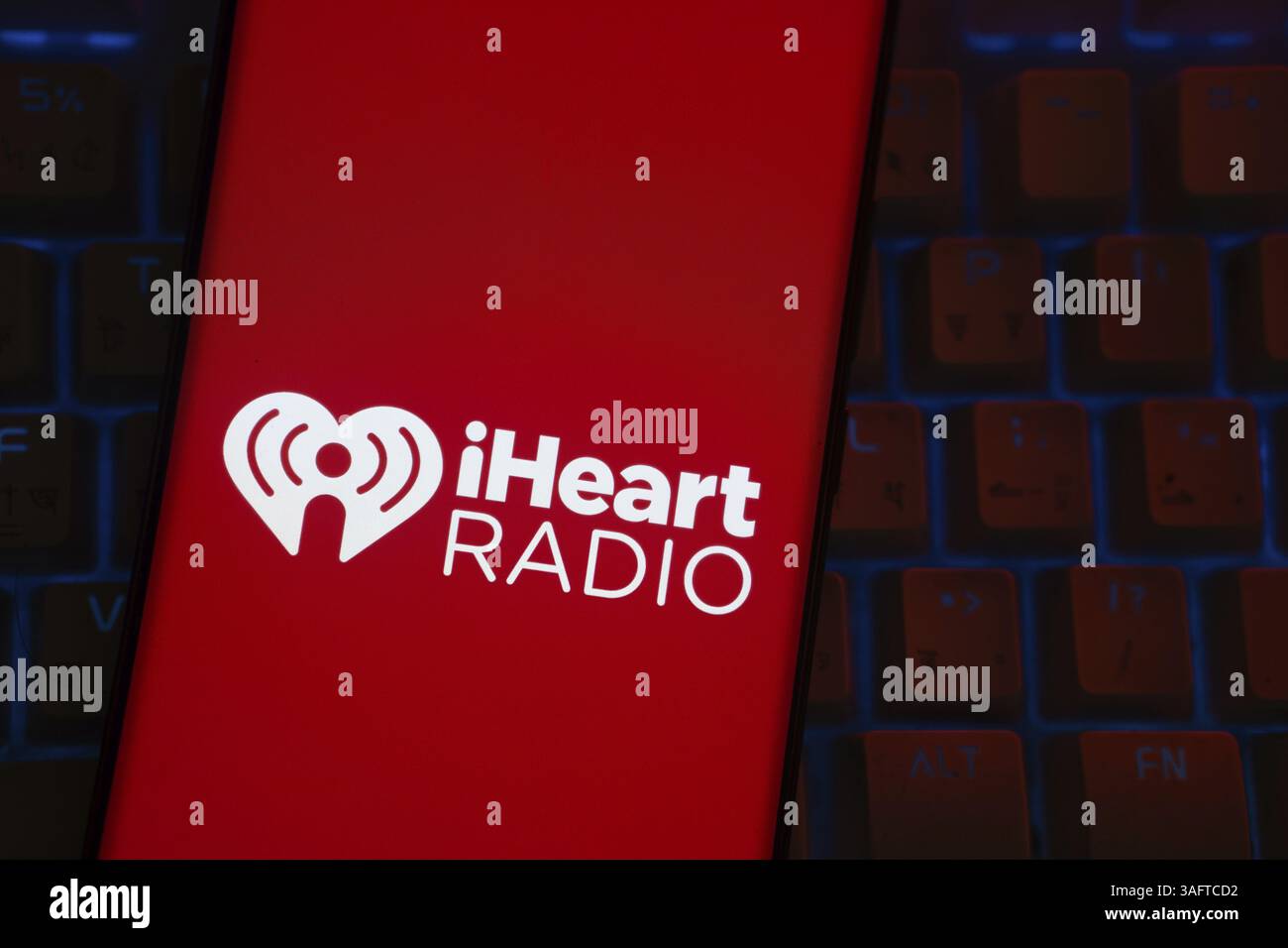 The logo of the iHeartRadio is displayed on a smartphone screen Stock ...