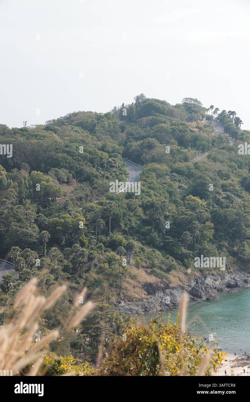 A Serene Coastal Landscape featuring Lush Green Hills and a Tranquil ...