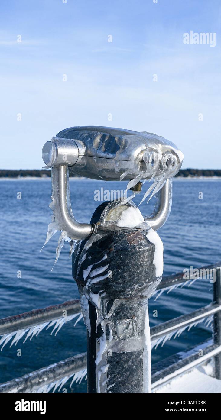 Frozen View Through a Public Telescope Sights Overlooking Icy Lake ...