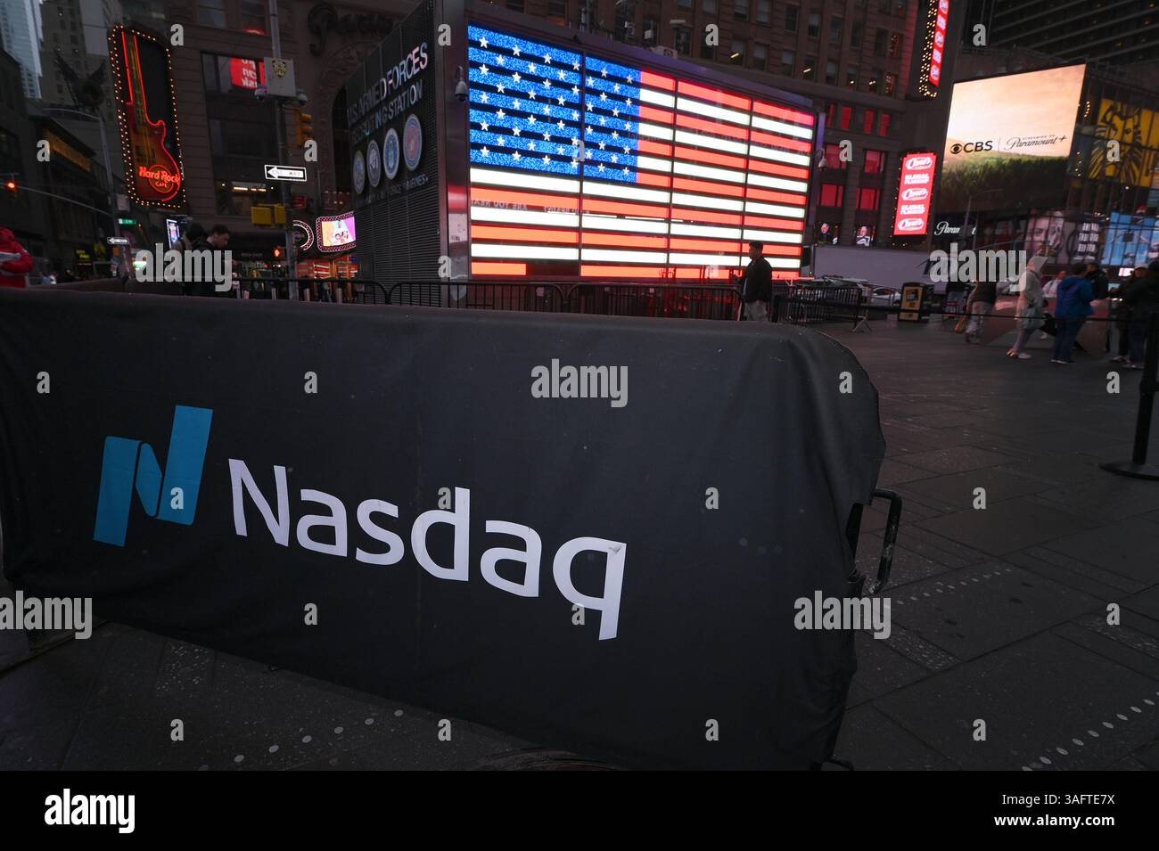 View of the Nasdaq banner on a barrier set outside their Times Square ...
