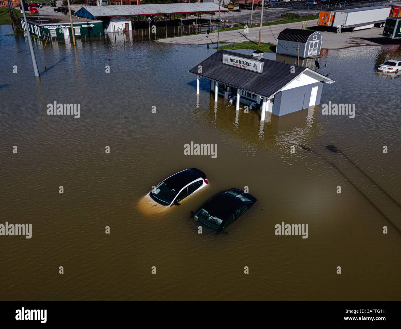 Vehicles are seen within the floodwaters from the Kentucky River on ...