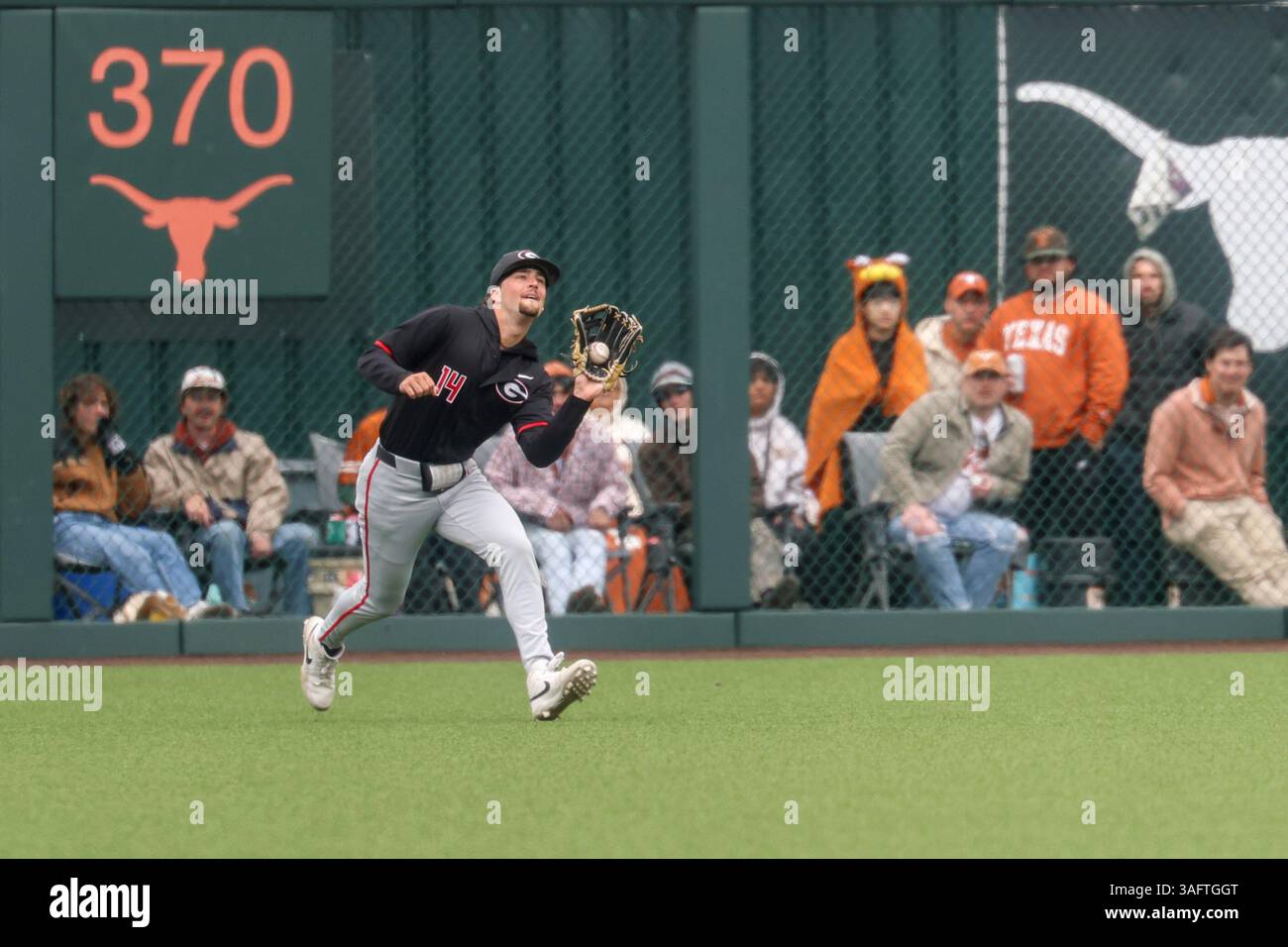 AUSTIN, TX - APRIL 06: Georgia infielder Trey King (14) catches a fly ...
