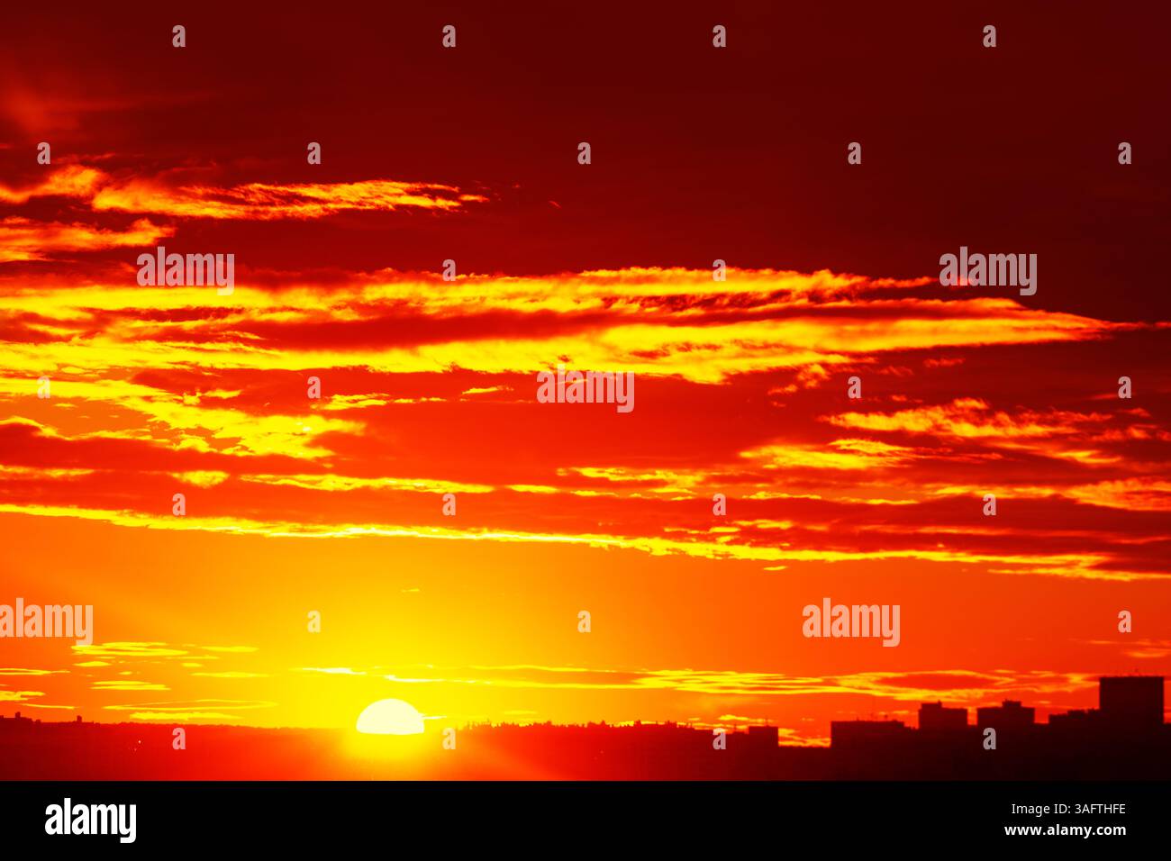 Radiant sunset spilling across the sky, creating a dramatic and warm ...