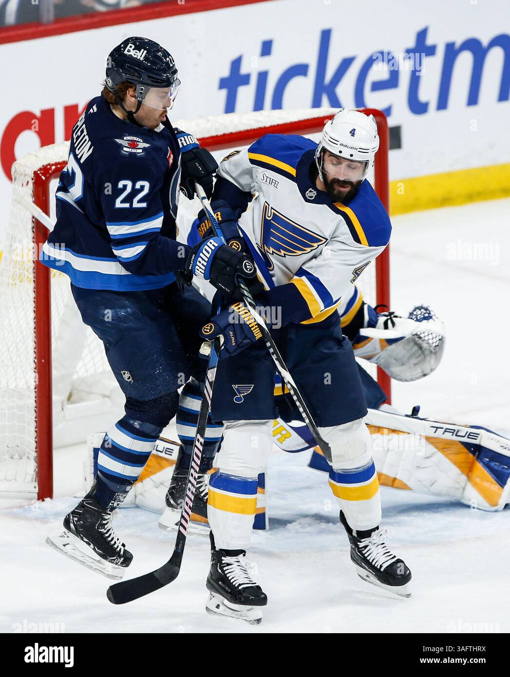 St. Louis Blues' Nick Leddy (4) defends against Winnipeg Jets' Mason ...