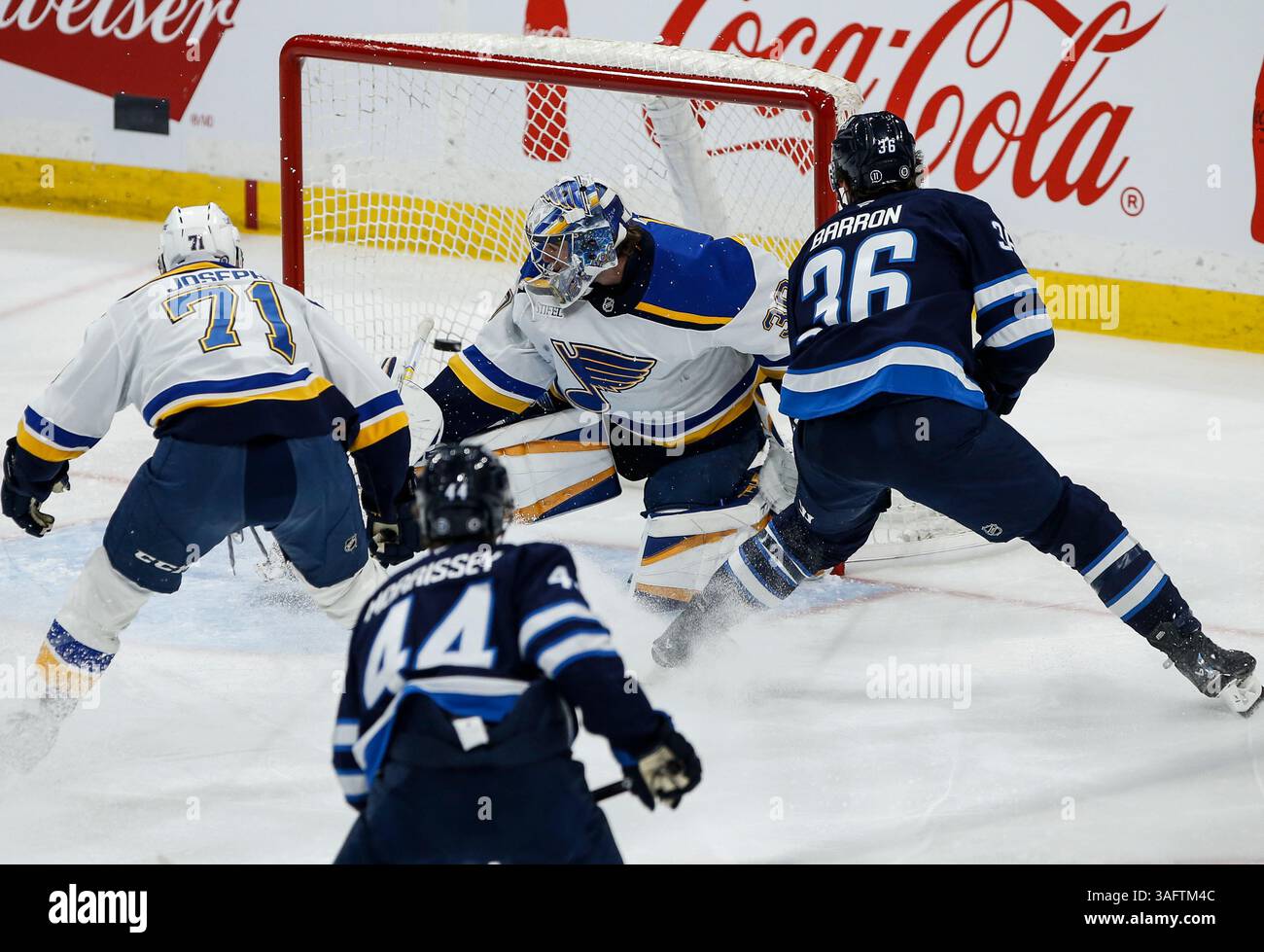 Winnipeg Jets' Morgan Barron (36) scores against St. Louis Blues goaltender Joel Hofer (30 ...