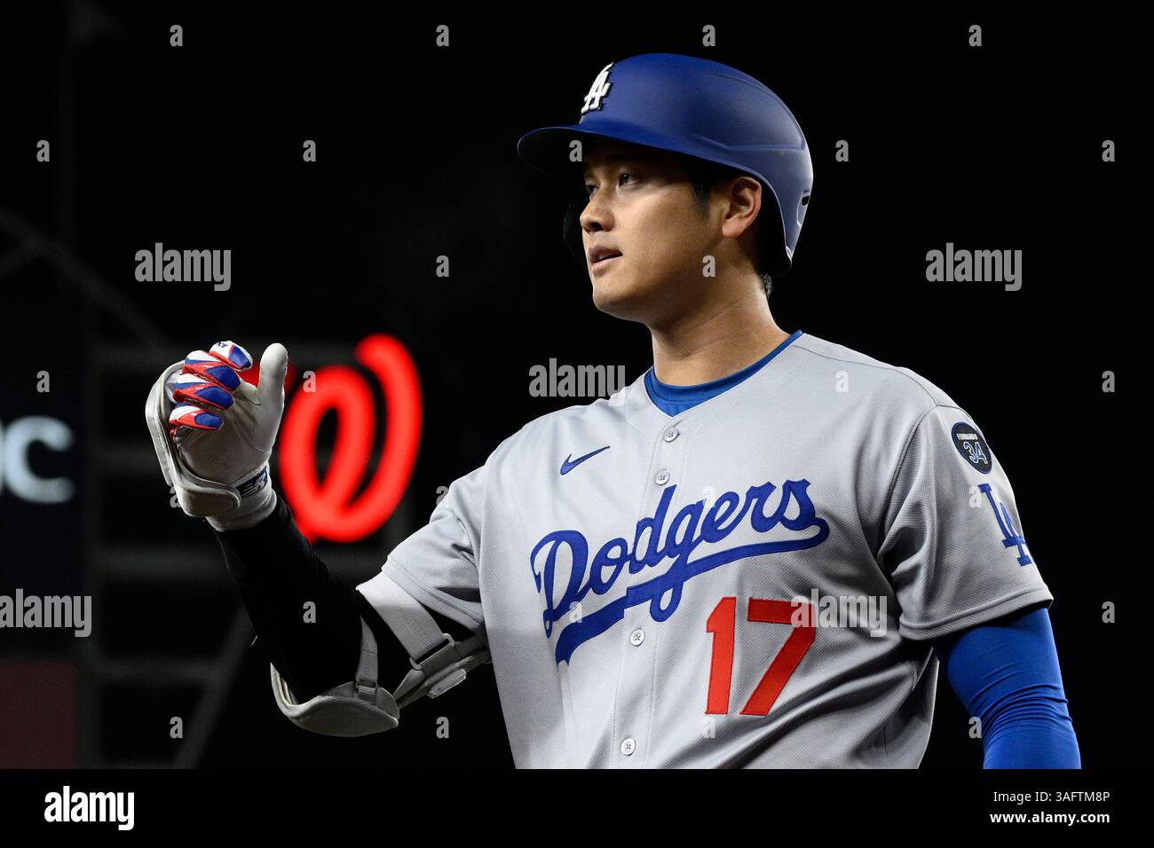 Los Angeles Dodgers' Shohei Ohtani walks back to the dugout after he struck out during the ...