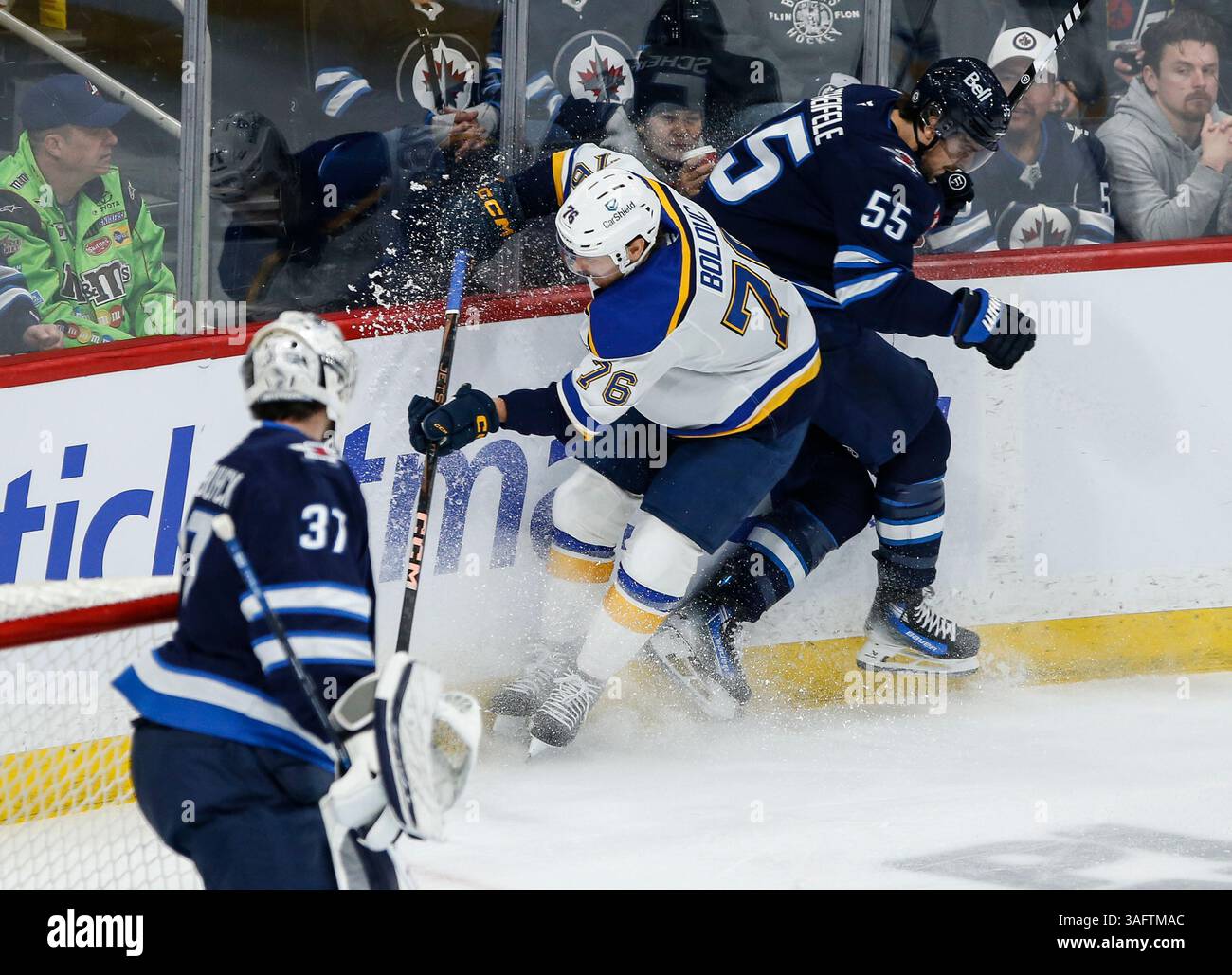 Winnipeg Jets' Mark Scheifele (55) and St. Louis Blues' Zack Bolduc (76 ...