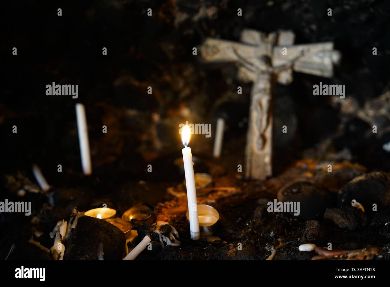 Qaraqosh, Iraq. 06th Apr, 2025. View of a burning candle on the ruins ...
