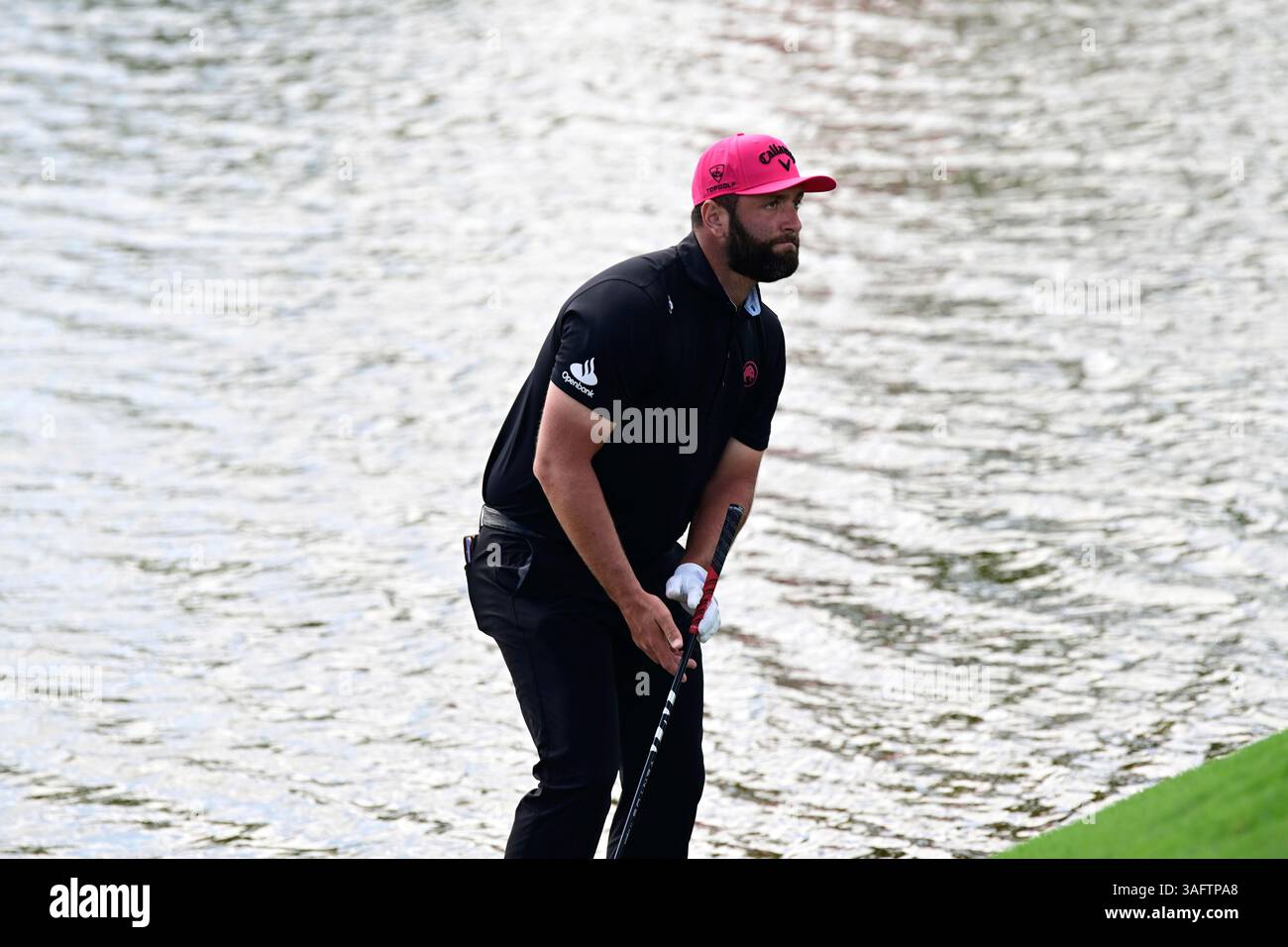 DORAL, FL - APRIL 06: Jon Rahm, waits his turn to hit a chip shot on ...