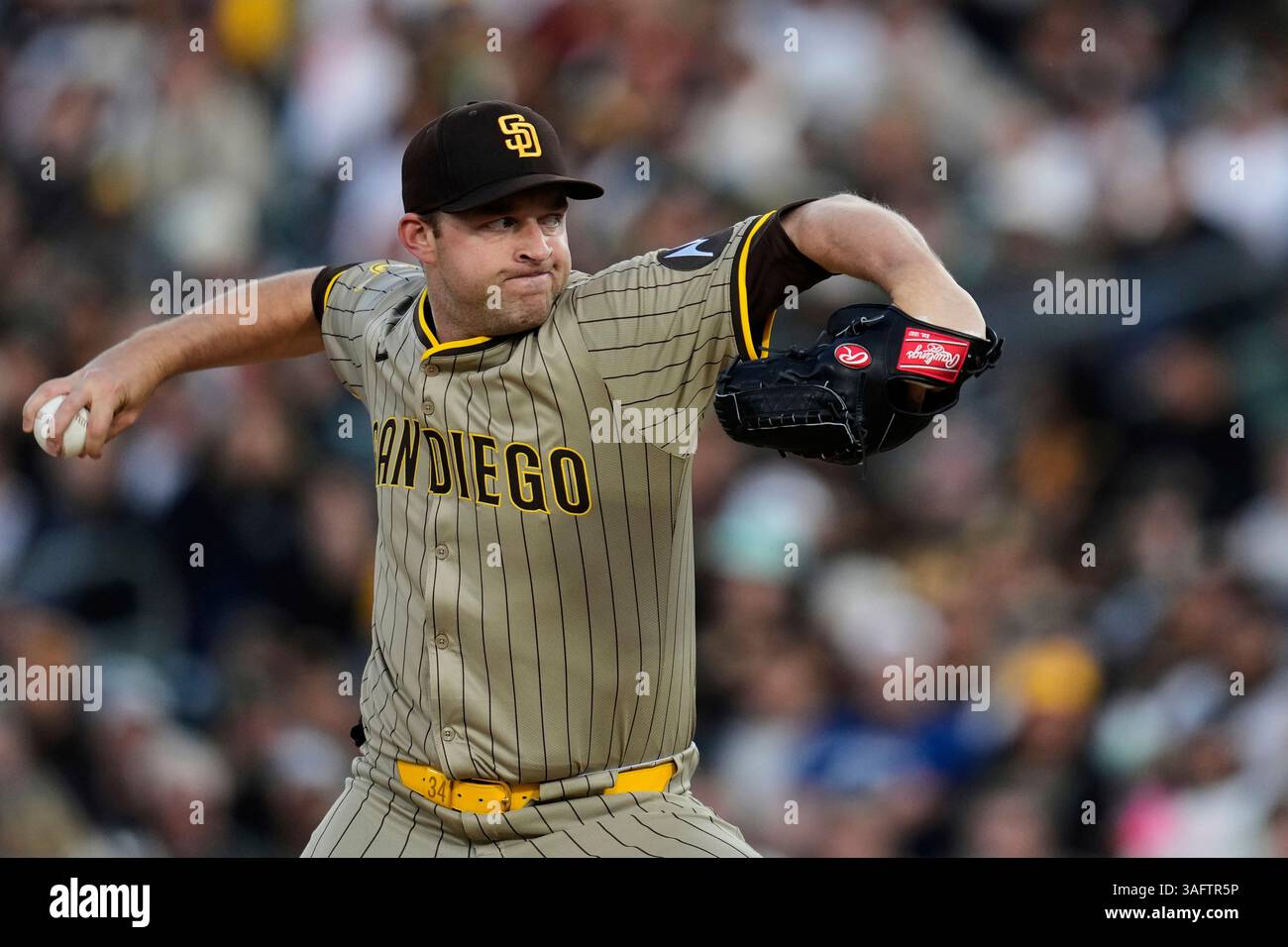 San Diego Padres pitcher Michael King throws to an Athletics batter ...
