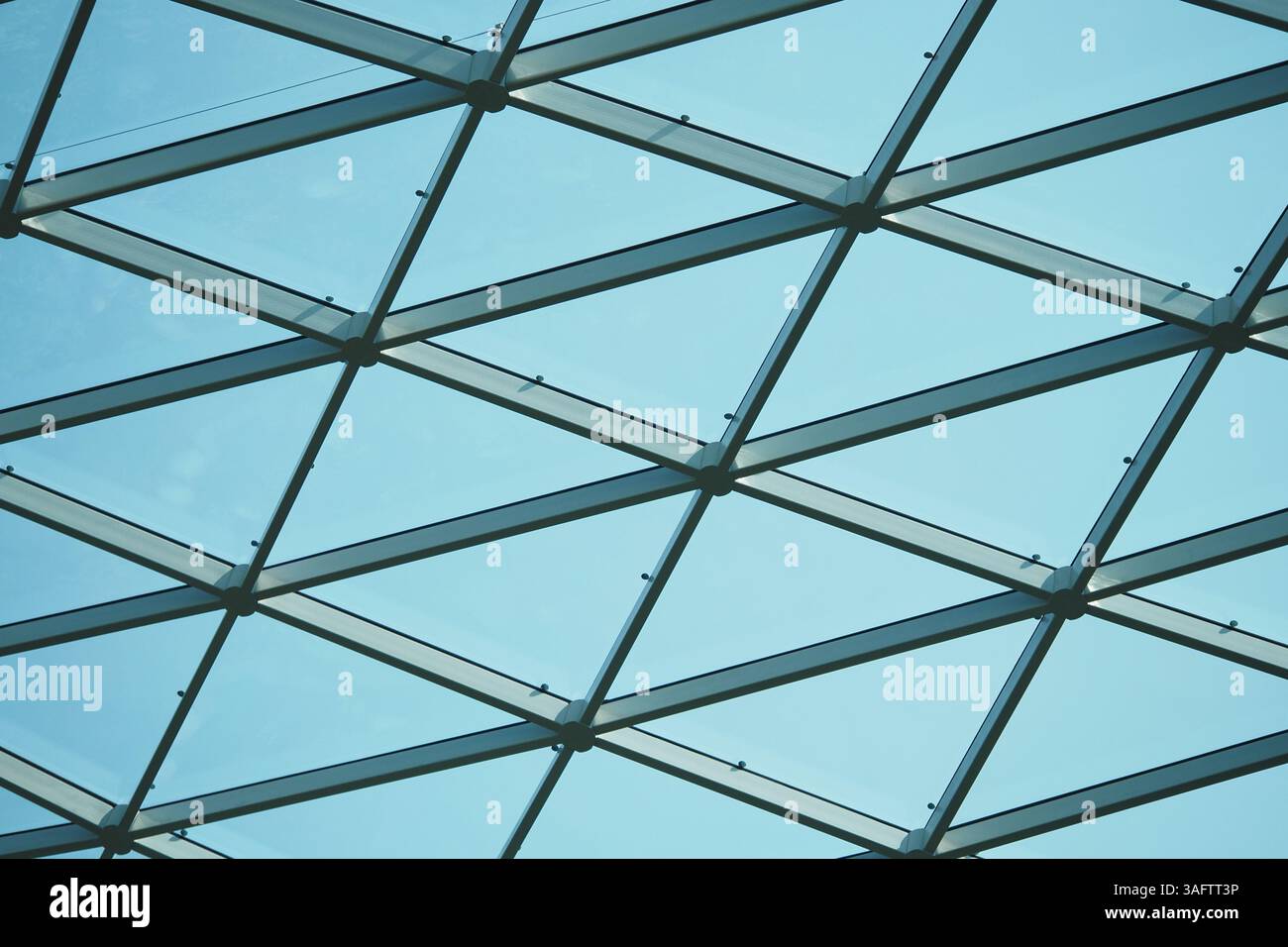 Modern glass structure creates a striking pattern against the sky Stock ...