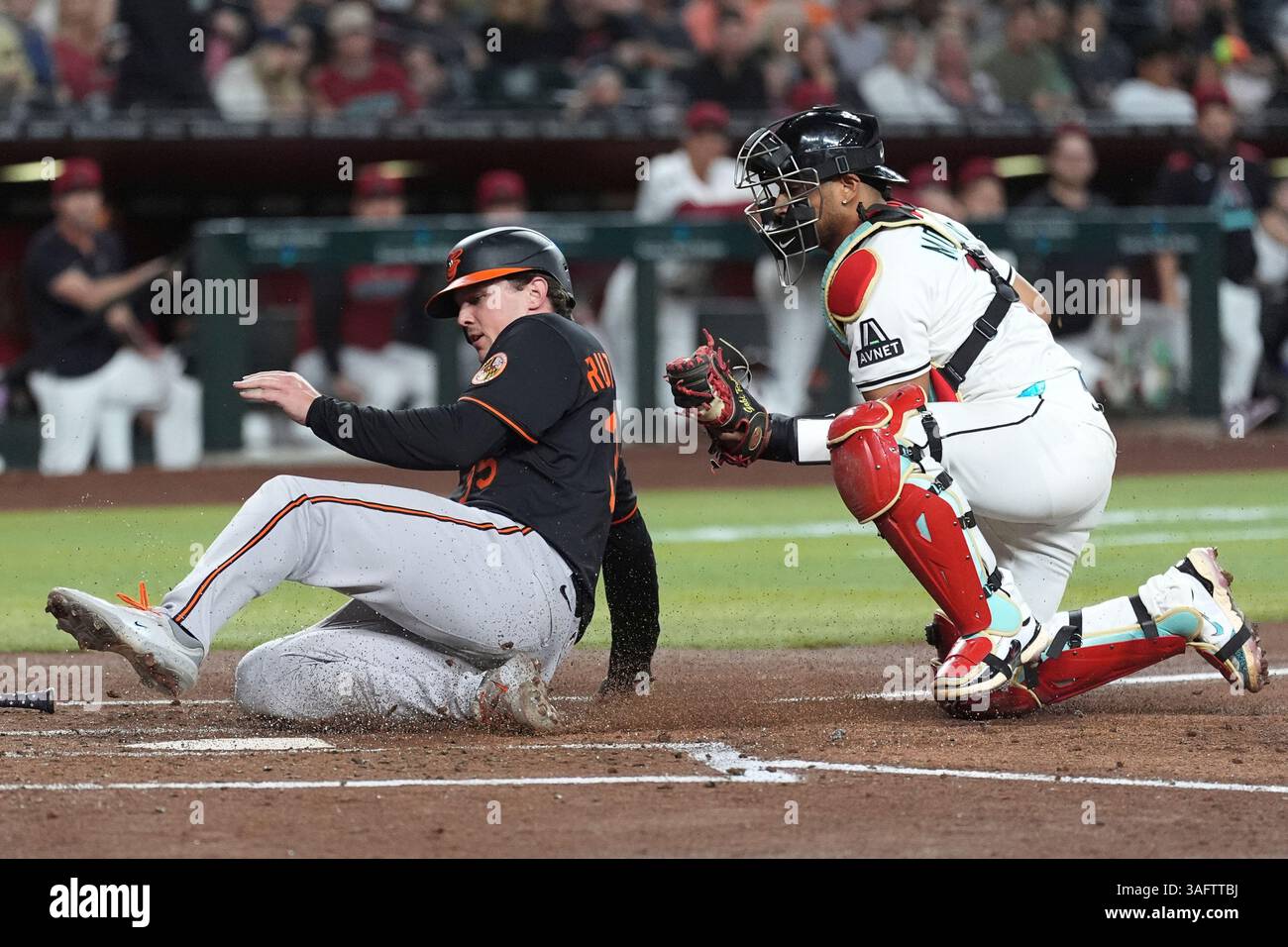 Arizona Diamondbacks catcher Gabriel Moreno, right, tags out Baltimore ...