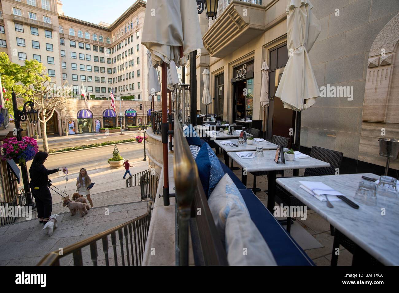 Visitors walk past empty tables at the "208 Rodeo" restaurant in Rodeo ...