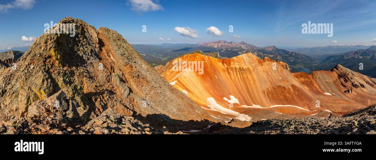 The summit of San Miguel Peak (13,756') and colorful Lake Point Peak in ...