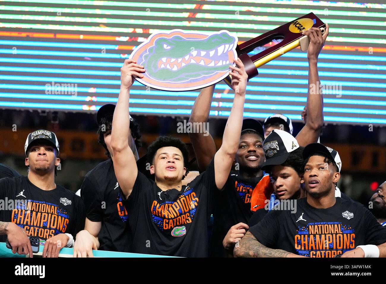 Florida celebrates with the trophy after their win against the Houston ...